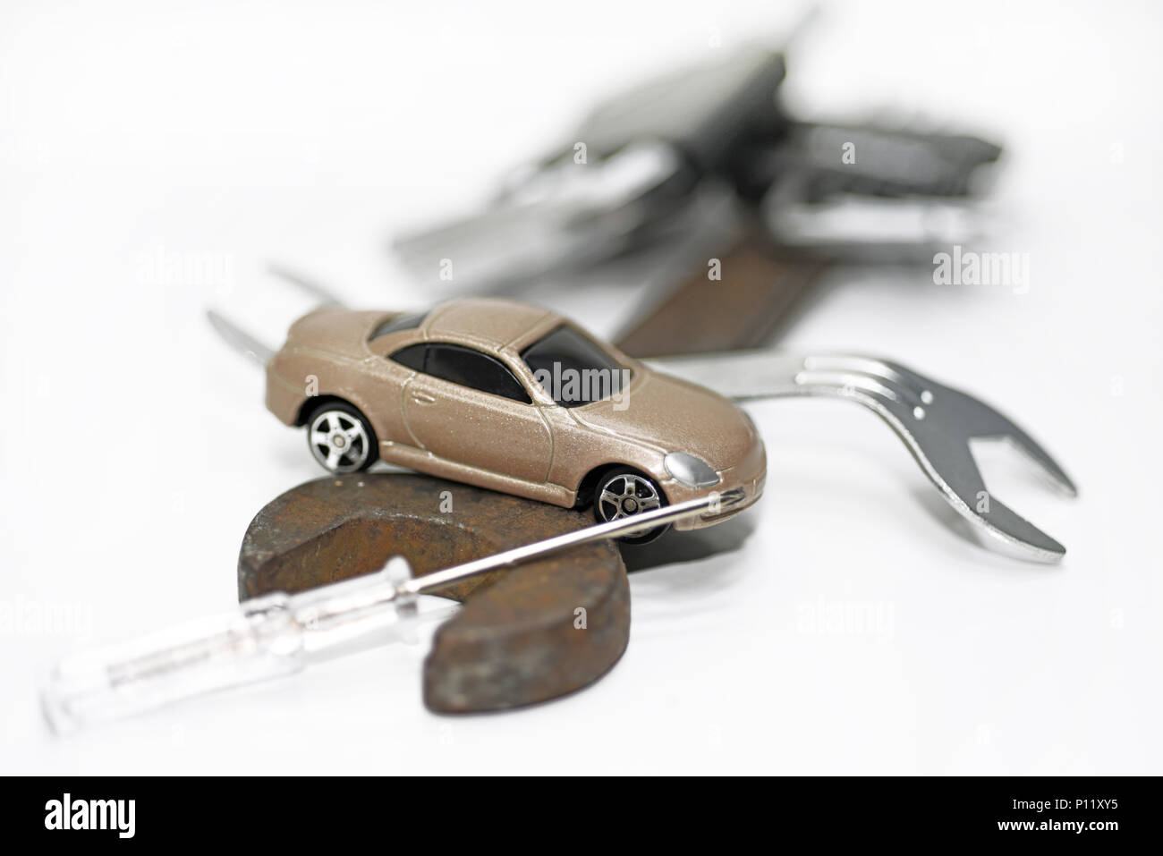 Abstract composition of broken car and repair process Stock Photo - Alamy