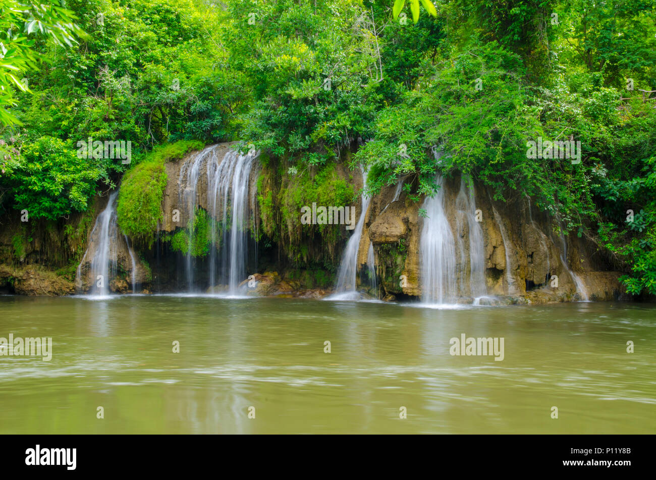 Tropical waterfall in rain forest Stock Photo - Alamy