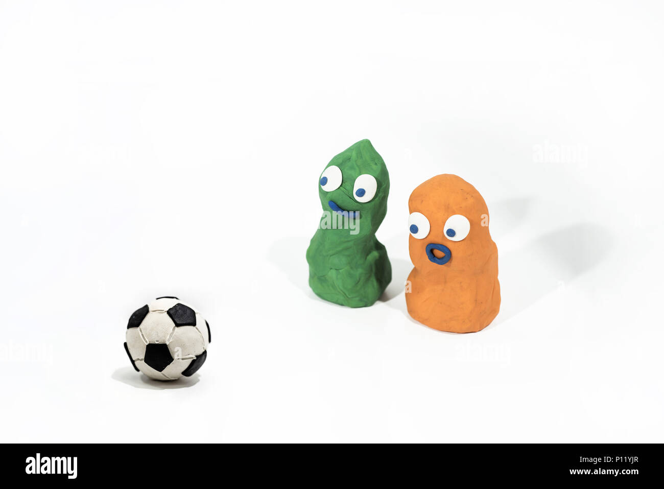 Abstract photo made pro Play Clay. Football ball with some objects ...