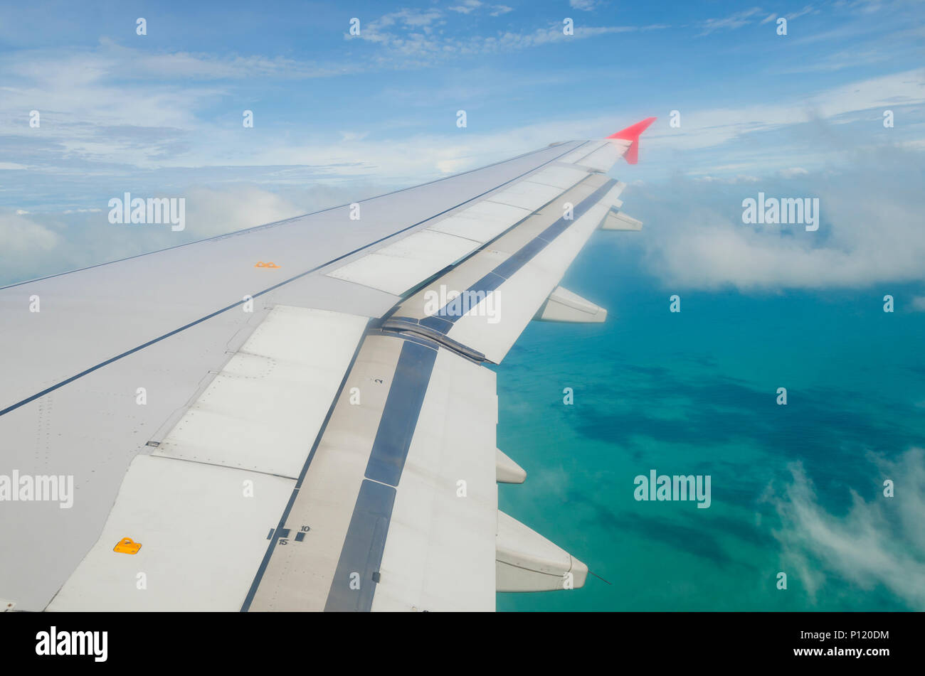 Airplane Wing in Flight, looking through window Stock Photo - Alamy