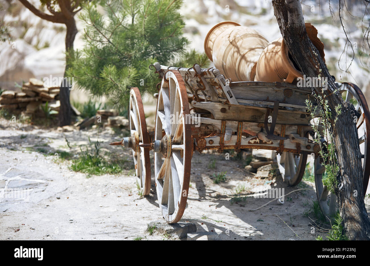 Ancient wooden wheeled wagon with pots Stock Photo - Alamy