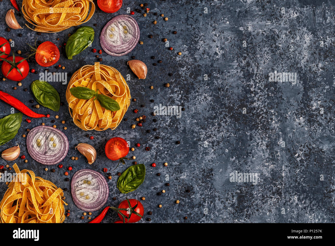 Italian food background with pasta, spices and vegetables. Top view ...