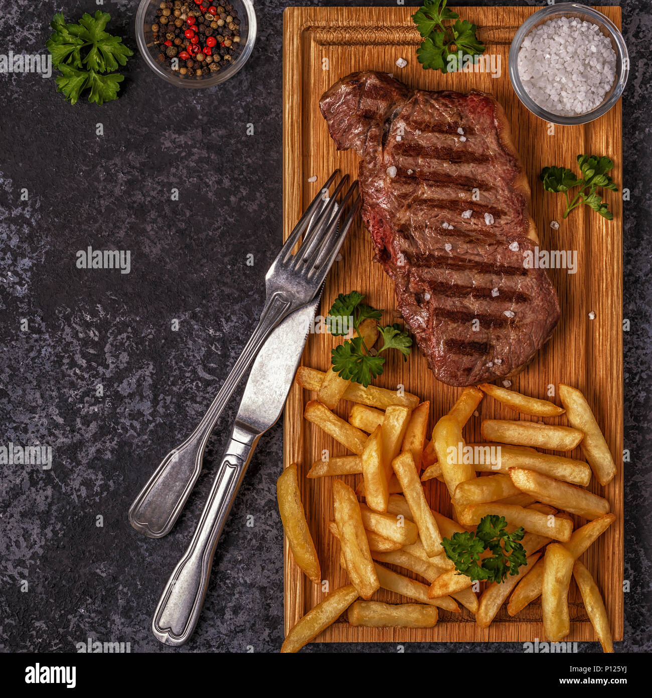 Beef barbecue steak with french fries, top view Stock Photo - Alamy