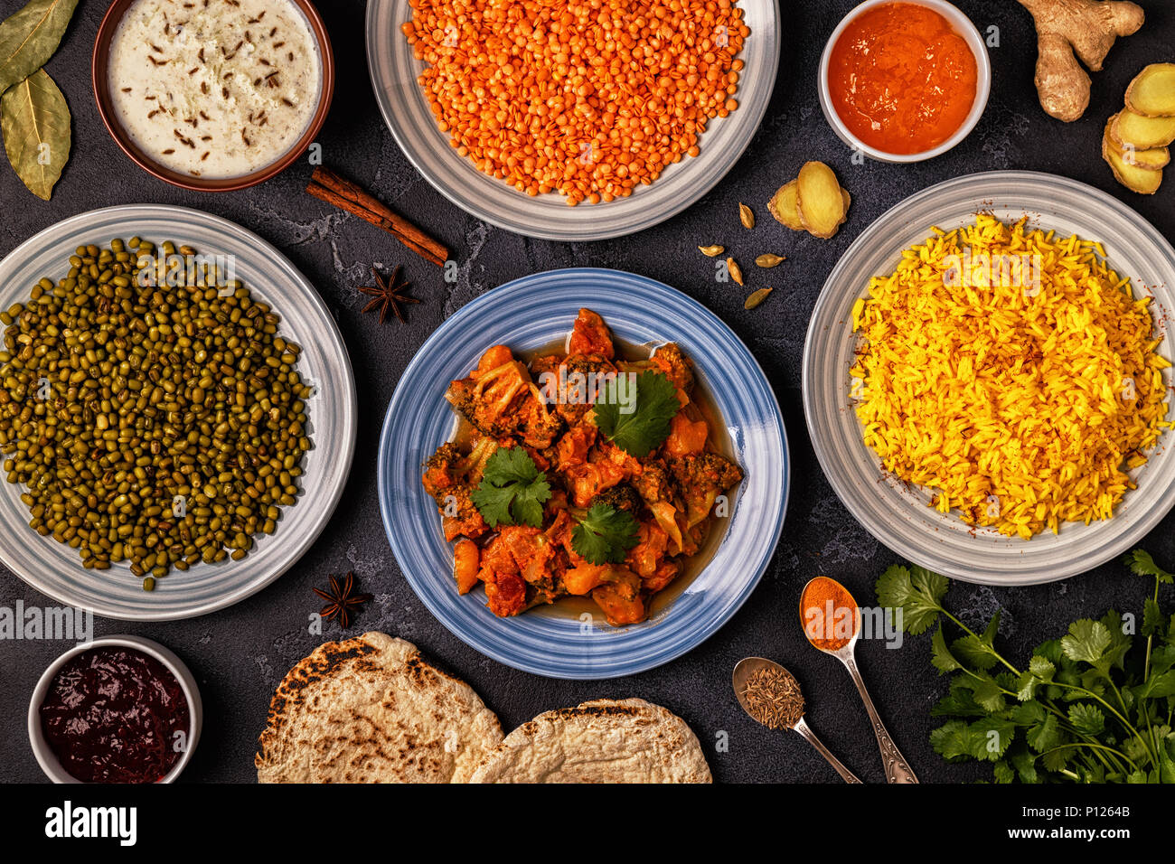 Traditional Indian curry with rice, lentils and mung beans. Top view ...