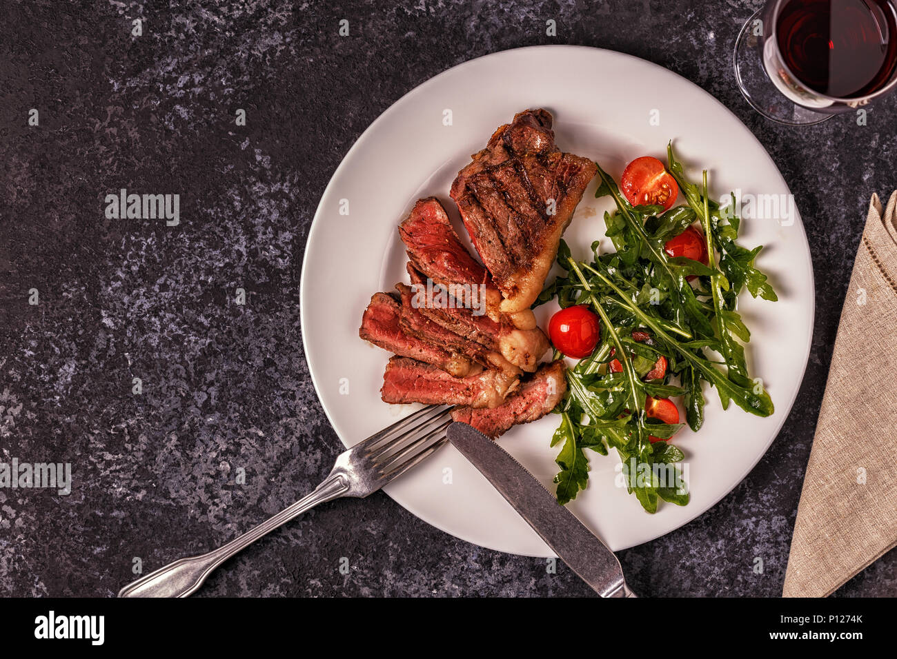 Beef steak on a dark background. Top view, copy space Stock Photo - Alamy