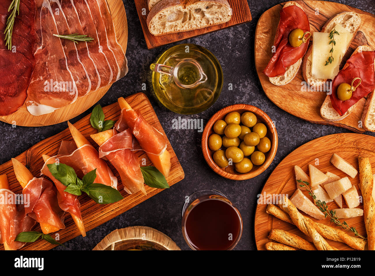 Italian food background with ham, cheese, olives, bread, wine Stock ...
