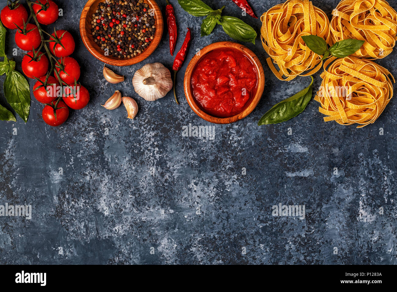 Italian food background with pasta, spices and vegetables. Top view ...