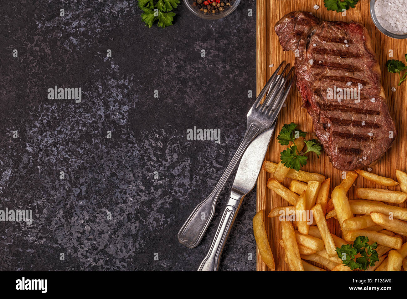Beef barbecue steak with french fries, top view Stock Photo - Alamy