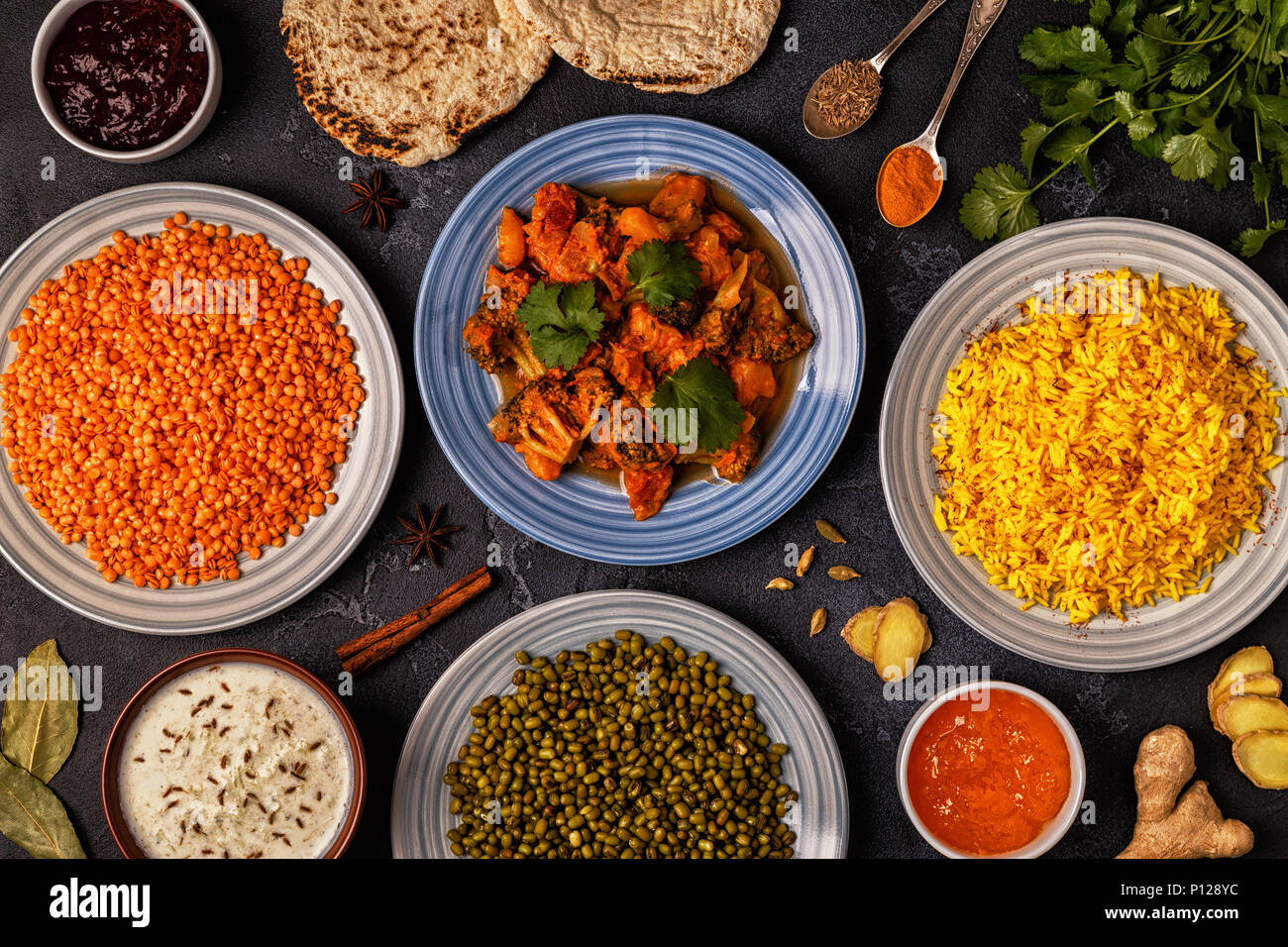 Traditional Indian curry with rice, lentils and mung beans. Top view ...