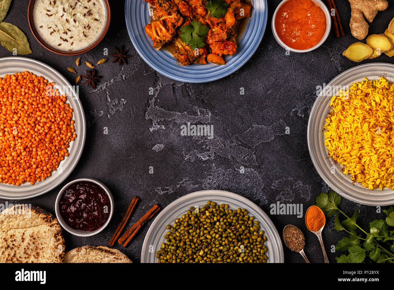 Traditional Indian curry with rice, lentils and mung beans. Top view ...