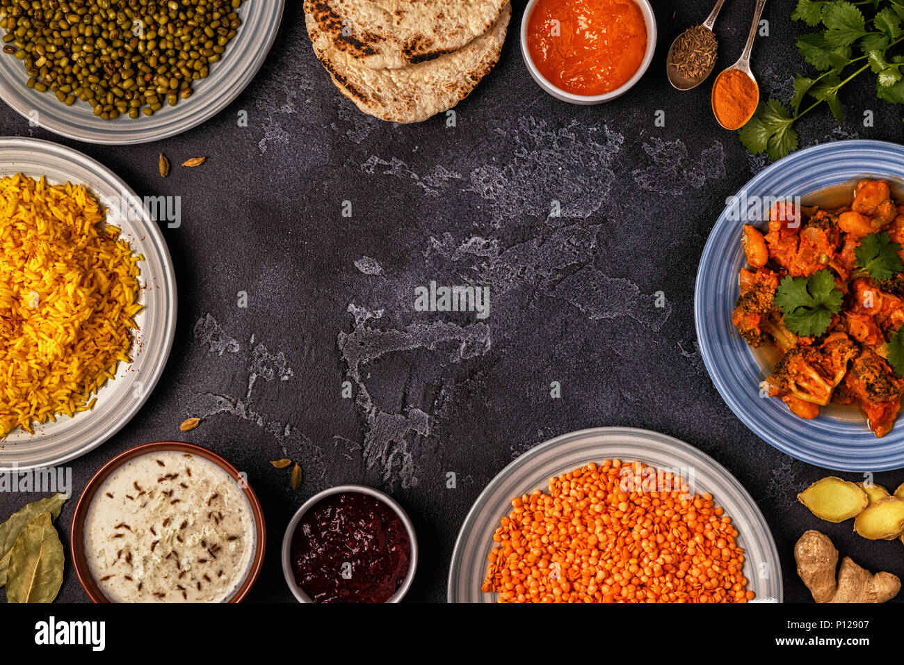 Traditional Indian curry with rice, lentils and mung beans. Top view ...