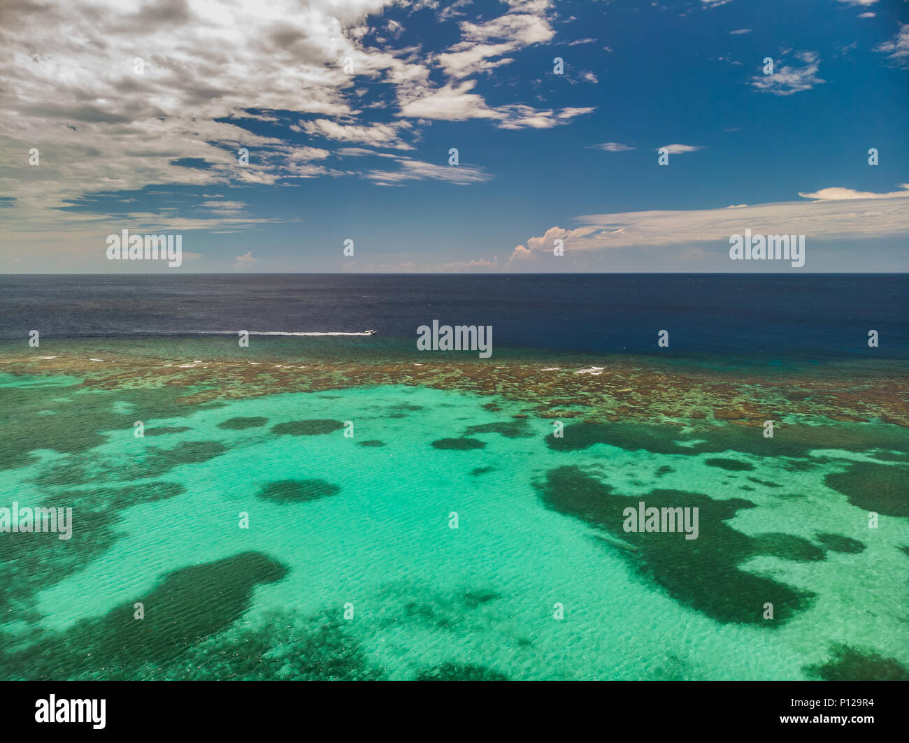 Aerial view of coral reef, Caribbean Sea and a boat Stock Photo - Alamy