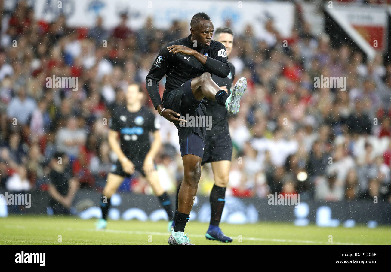 World XI's Usain Bolt warms up prior to the UNICEF Soccer Aid match at ...