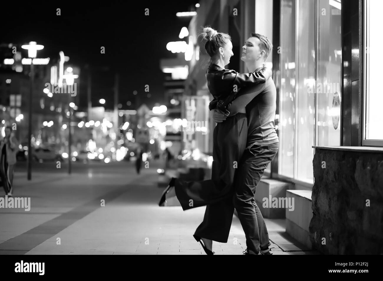 Beautiful couple on a date in a night city outdoor Stock Photo - Alamy