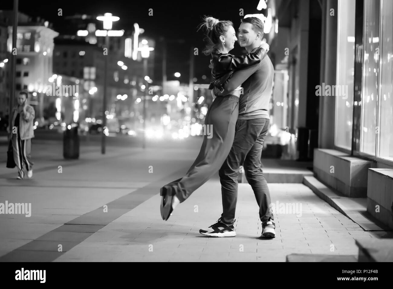 Beautiful couple on a date in a night city outdoor Stock Photo - Alamy