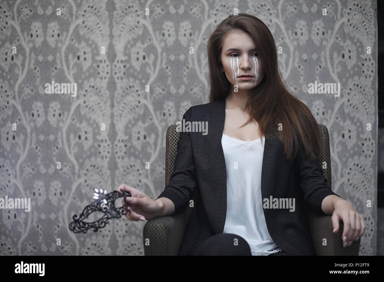 Beautiful girl with tears in eyes. Young girl with painted tears posing ...