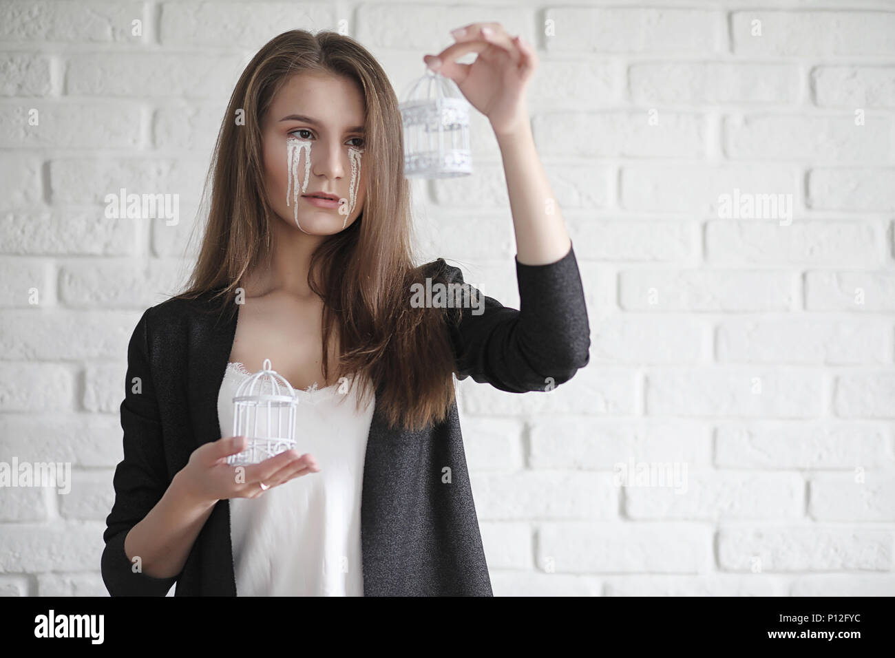 Beautiful girl with tears in eyes. Young girl with painted tears posing ...