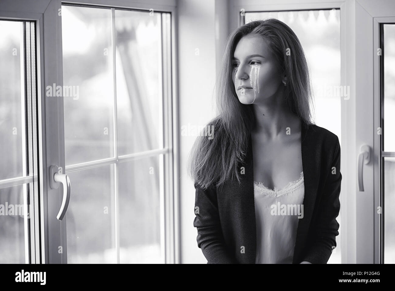 Beautiful girl with tears in eyes. Young girl with painted tears posing ...