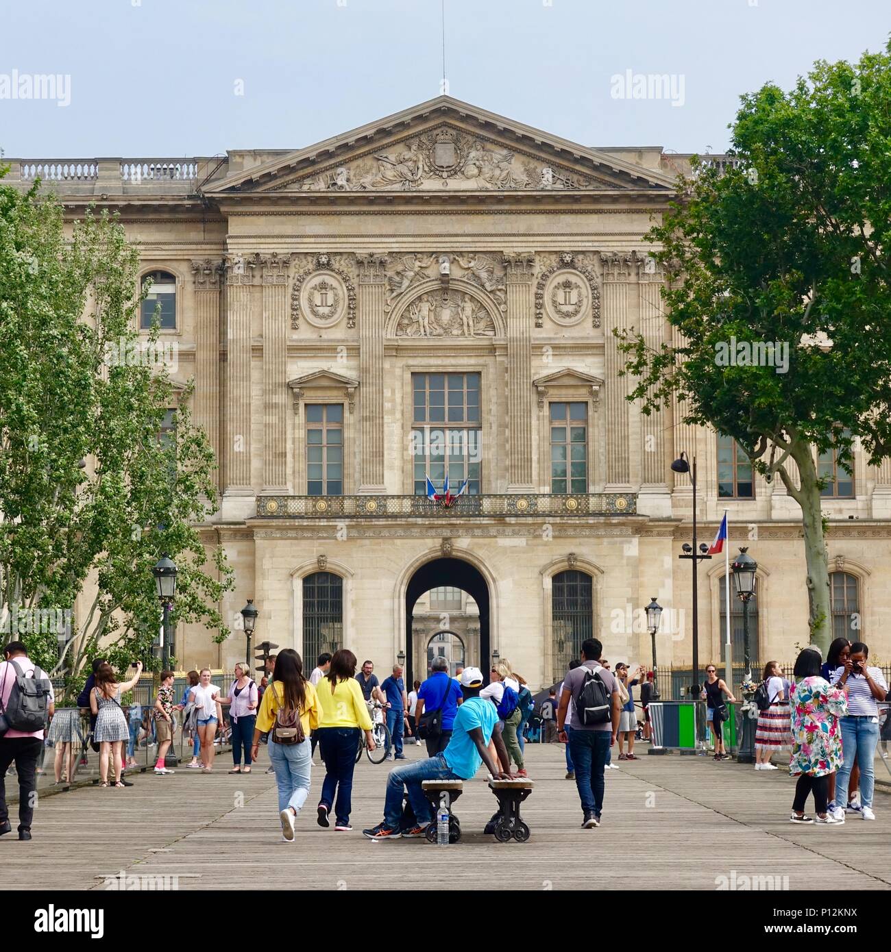 People, tourists, visitors, gathered on the Pont des Arts, known as the ...