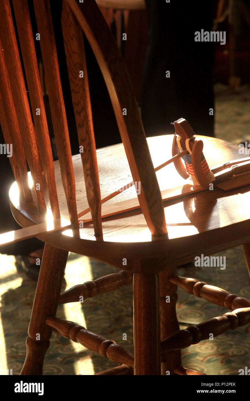 Wooden puppet on wooden chair Stock Photo - Alamy