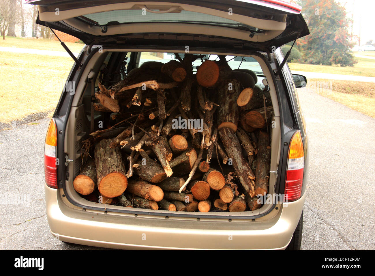 Mini van filled with firewood Stock Photo - Alamy