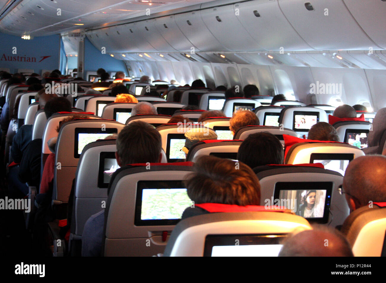 Interior of airplane during night flight Stock Photo - Alamy