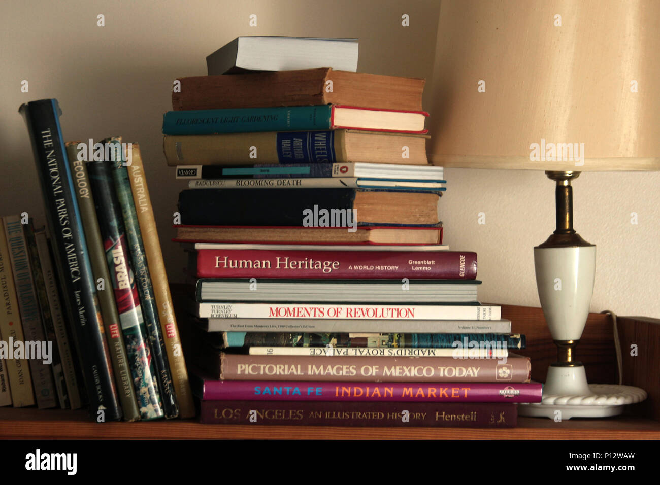 Stack of books on shelf Stock Photo - Alamy