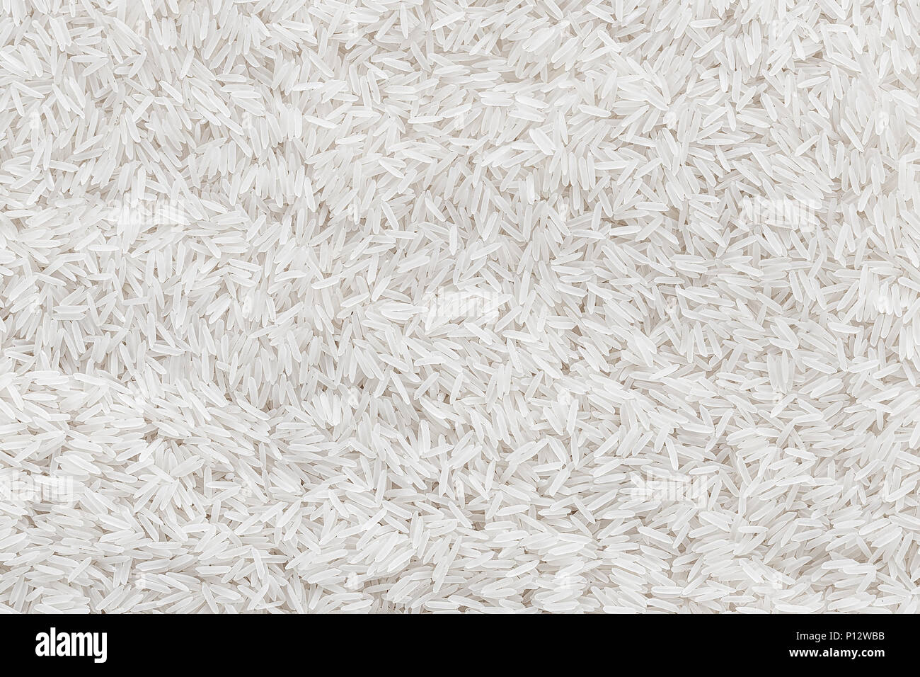 spilled crude basmati rice background, well some grain visible Stock ...