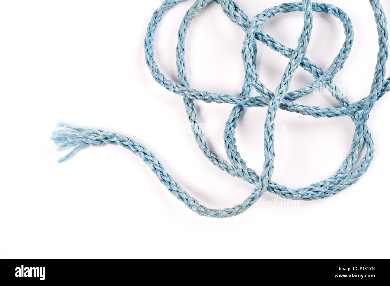 Entangled nylon rope on white background Stock Photo - Alamy