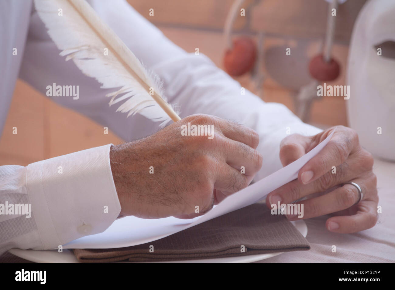 Hand white feather hi-res stock photography and images - Alamy