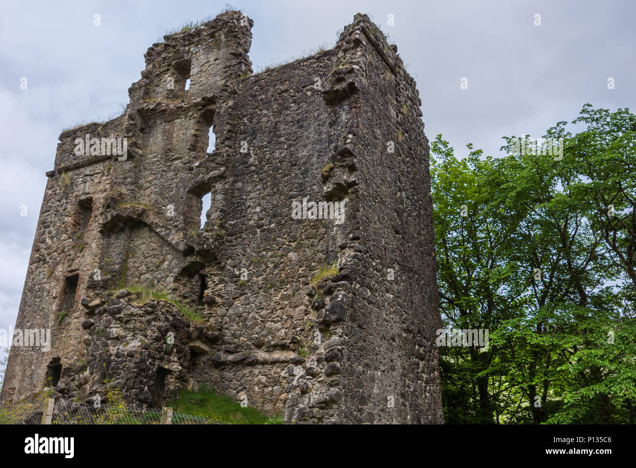 Invergarry, Scotland - June 11, 2012: Tall dark-brown ruined wall with ...