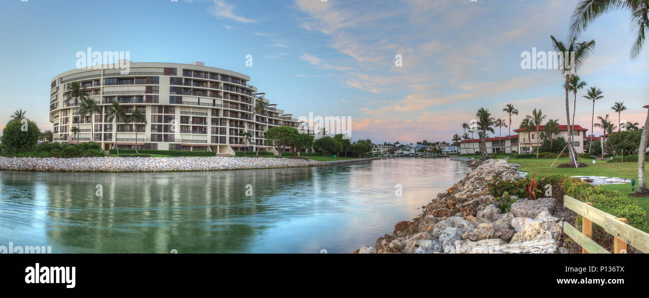 Sunset sky and clouds over the Doctors Pass river near Lowdermilk Beach ...