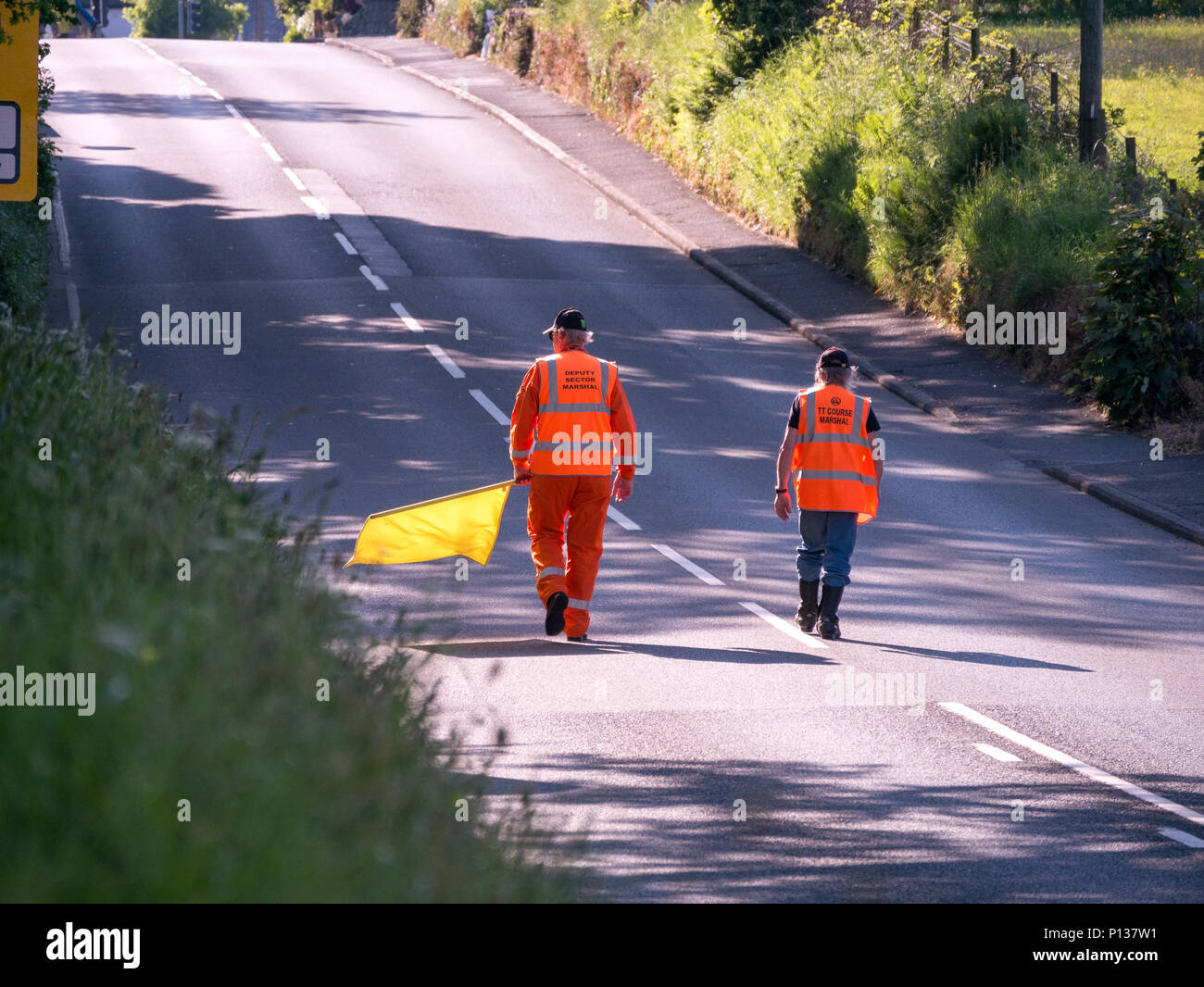 Course Marshal with yellow flag, Isle of Man TT 2018. Tourist Trophy ...
