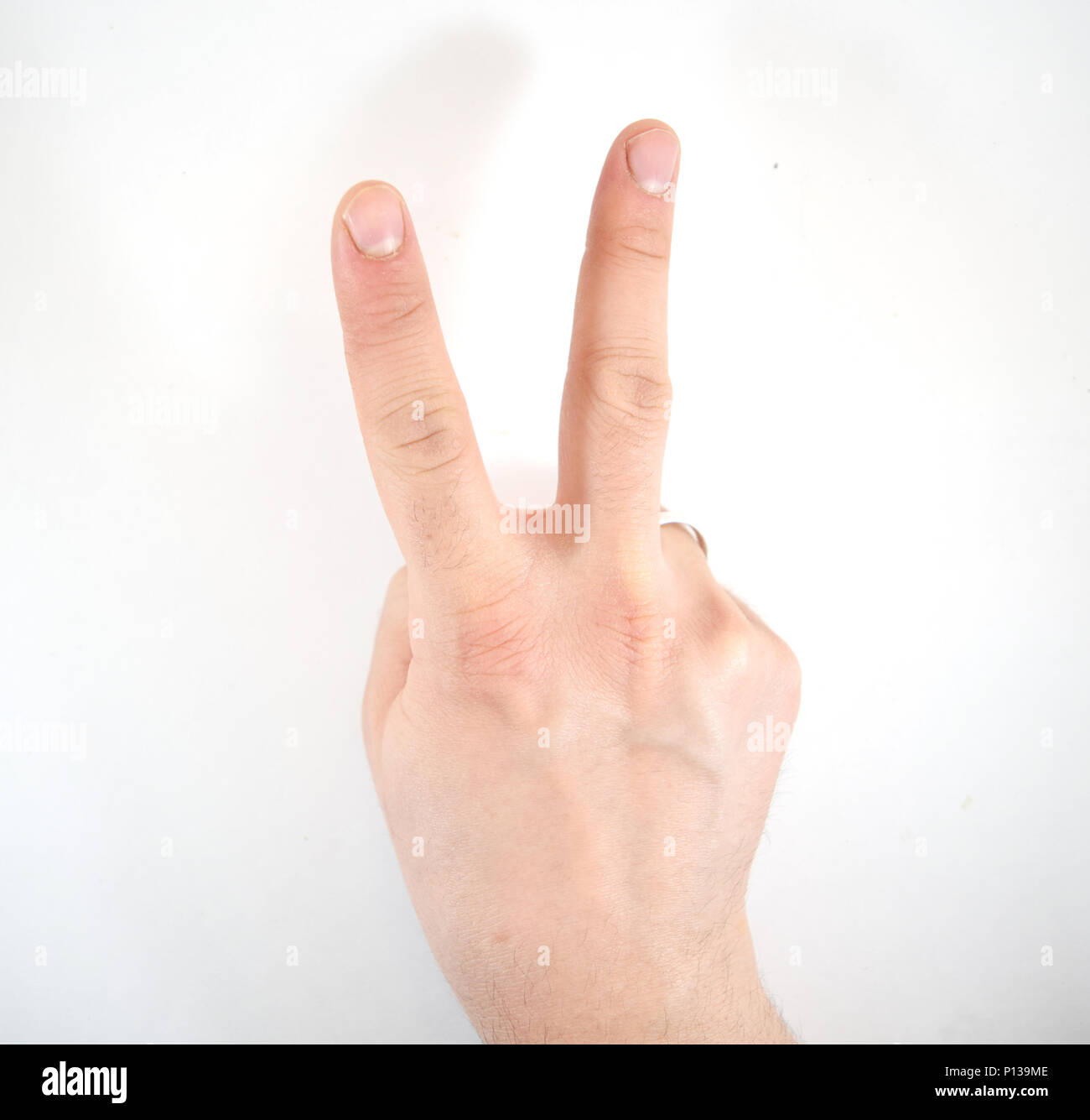 Hand making peace symbol - isolated Stock Photo - Alamy
