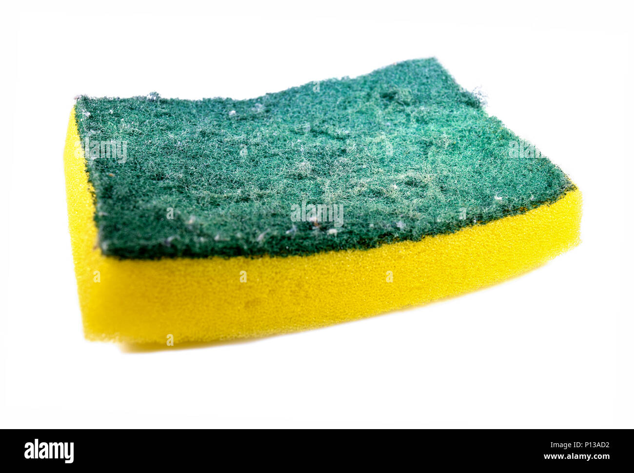 Used yellow sponge with dark green scrubber - isolated Stock Photo - Alamy