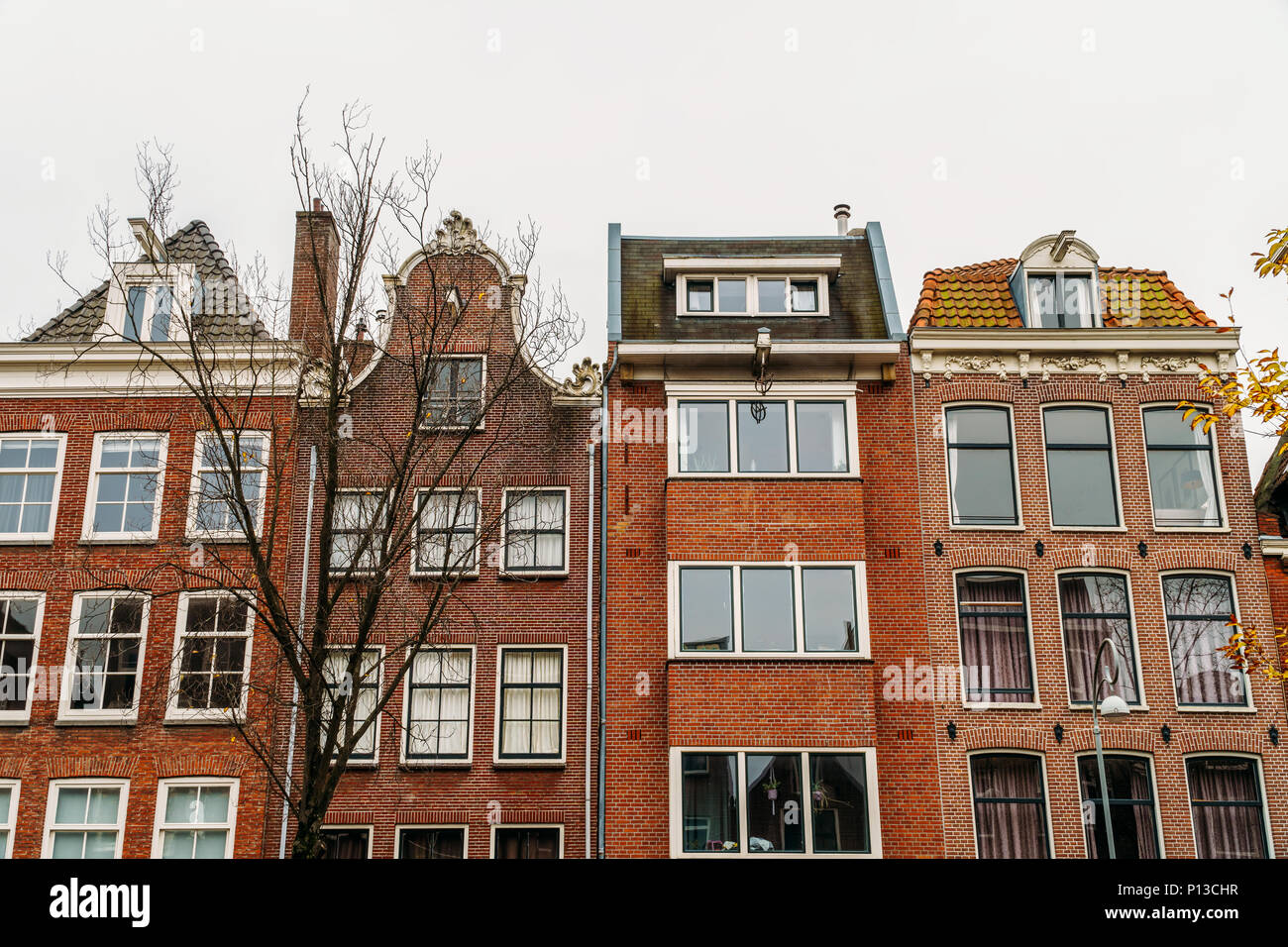 Dutch Houses Facade In Downtown Amsterdam City Stock Photo - Alamy