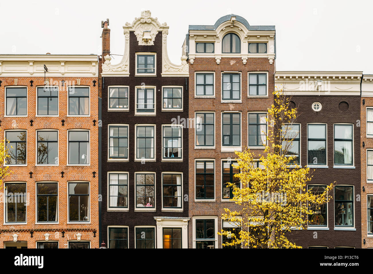 Dutch Houses Facade In Downtown Amsterdam City Stock Photo - Alamy