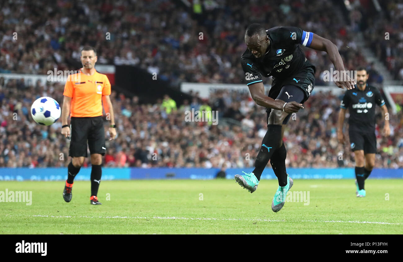 World XI's Usain Bolt has a shot on goal during the UNICEF Soccer Aid ...