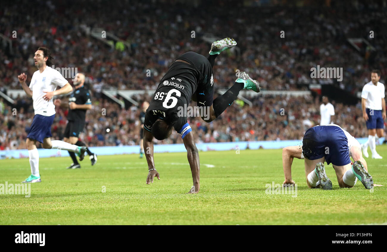World XI's Usain Bolt falls to the floor during the UNICEF Soccer Aid ...