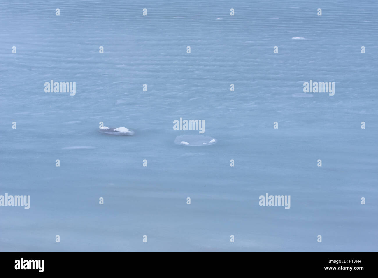 Snow sludge on water. Sludge on the sea surface Stock Photo - Alamy