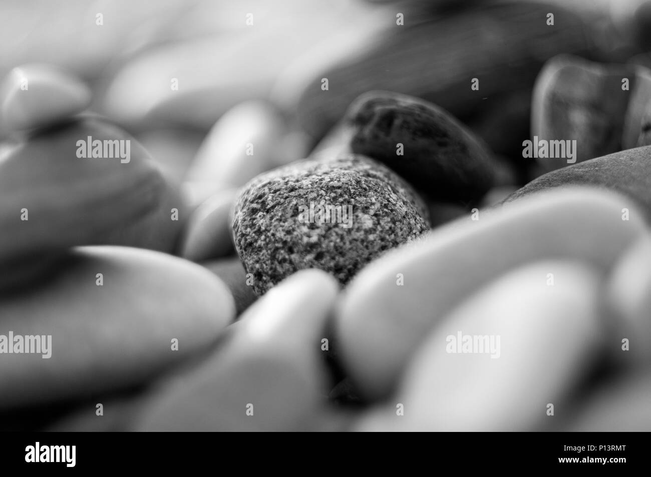 boulders and colorful pebbles on the beach on a warm summer day Stock ...