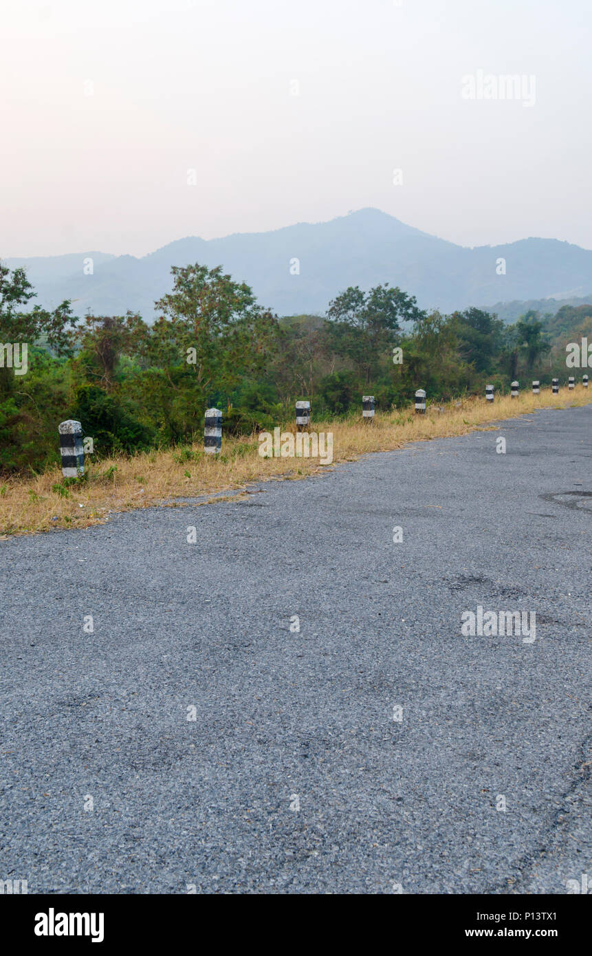 roadside pillar in the surface of natural road Stock Photo - Alamy