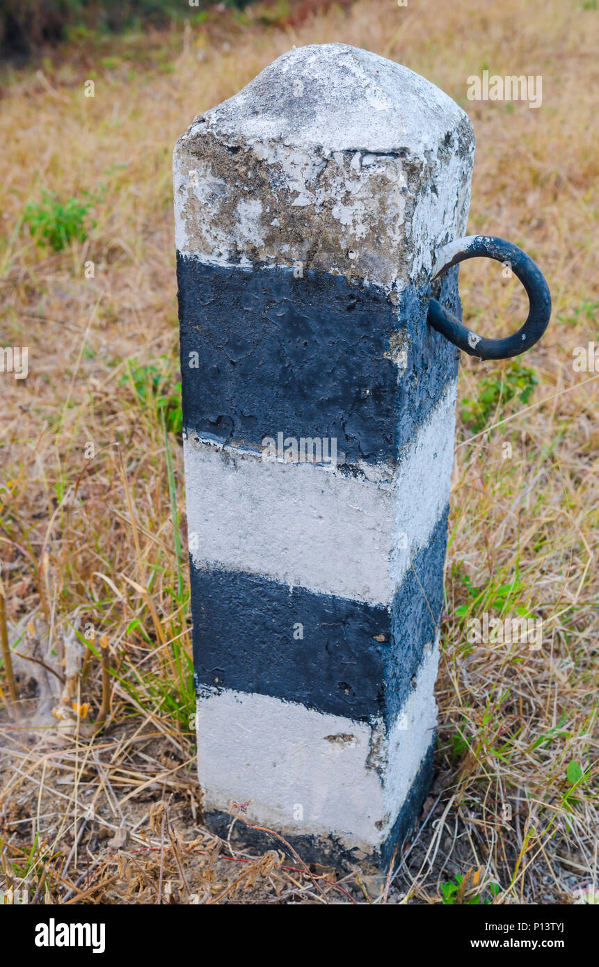 roadside pillar in the surface of natural road Stock Photo - Alamy