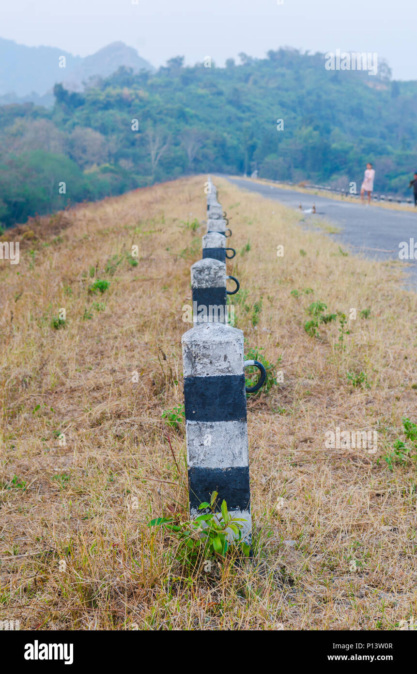 roadside pillar in the surface of natural road Stock Photo - Alamy