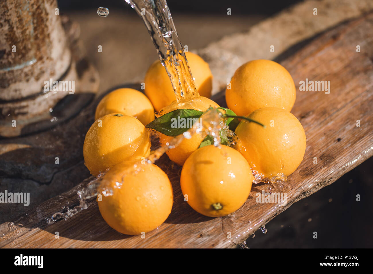 Oranges in water. Wash fruits.Healthy organic fruits Stock Photo - Alamy