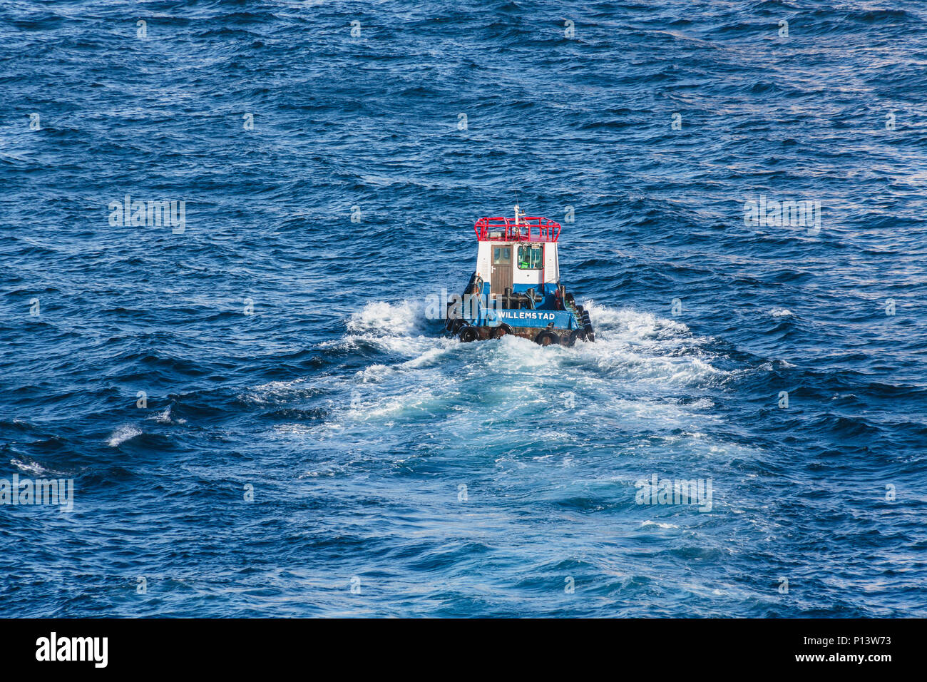 A pilot boat sailing into the harbor on Curacao Stock Photo - Alamy