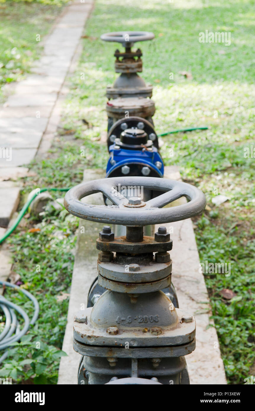 Valve of water pumping Stock Photo - Alamy