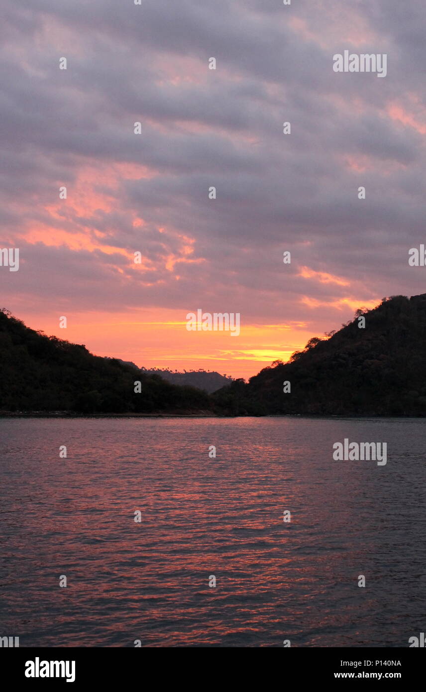Sunset on the Pacific Ocean Between Two Islands in Indonesia Stock ...