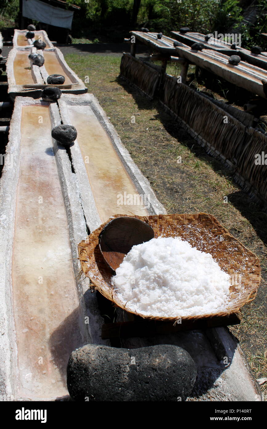 Traditional sea salt panning in Bali on the Indian Ocean Stock Photo ...
