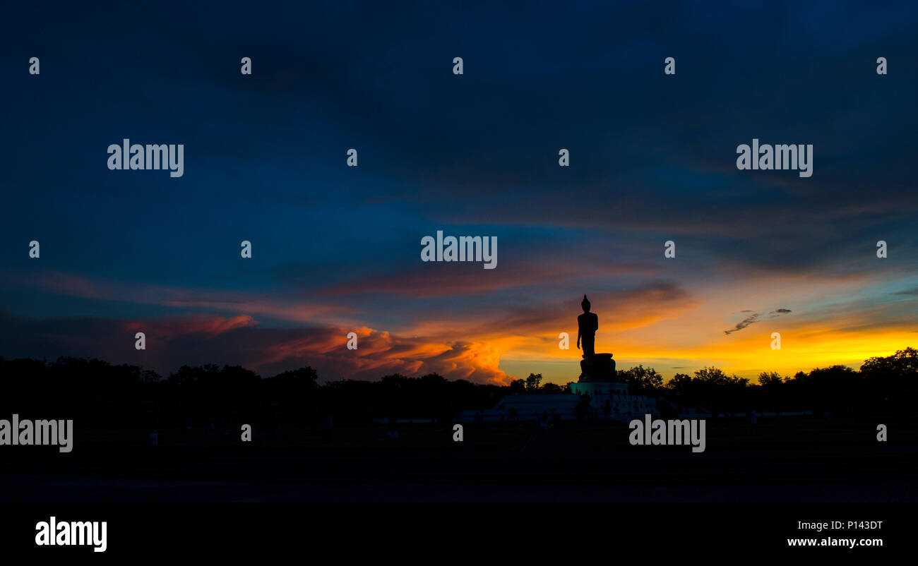 Biggest buddha statue in sunset background Stock Photo - Alamy